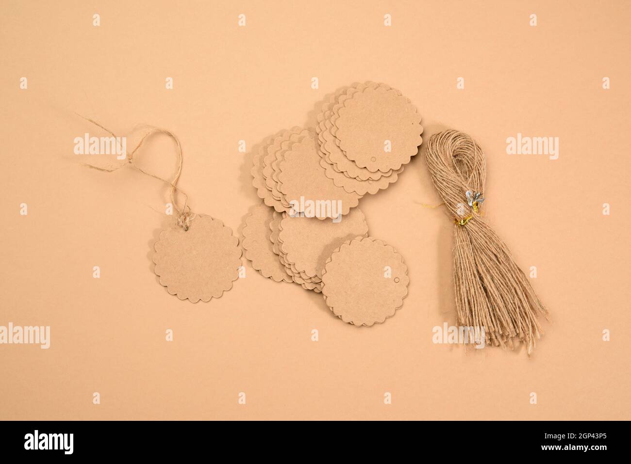 stack of brown paper tags and rope, top view Stock Photo - Alamy