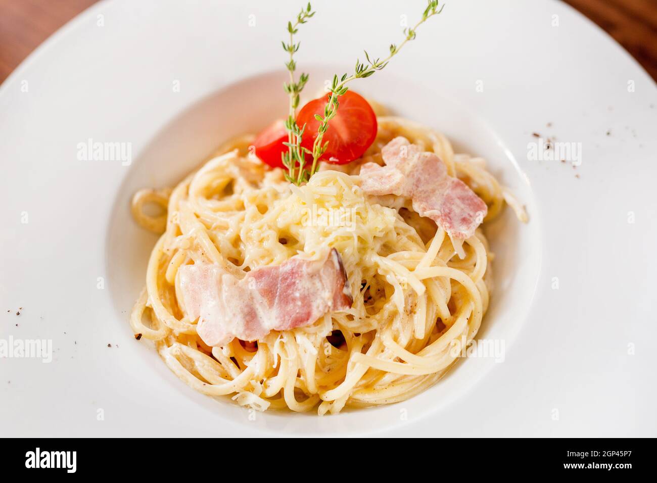 Italian pasta with bacon, tomatoes, cheese, oysters. European cuisine ...