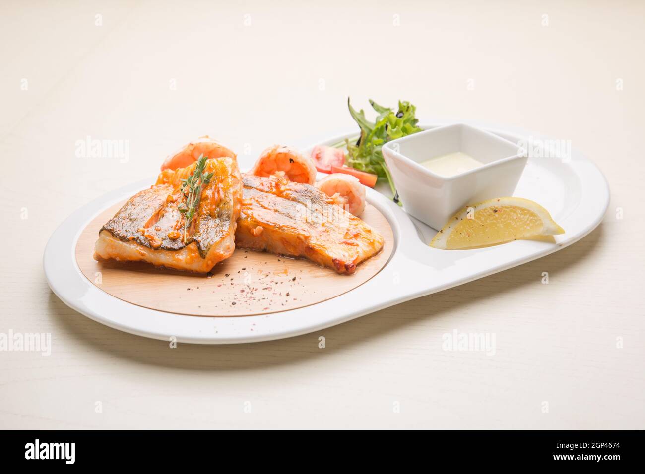 Baked salmon with grilled vegetables. Fish fillet with bulgur. Fish ...