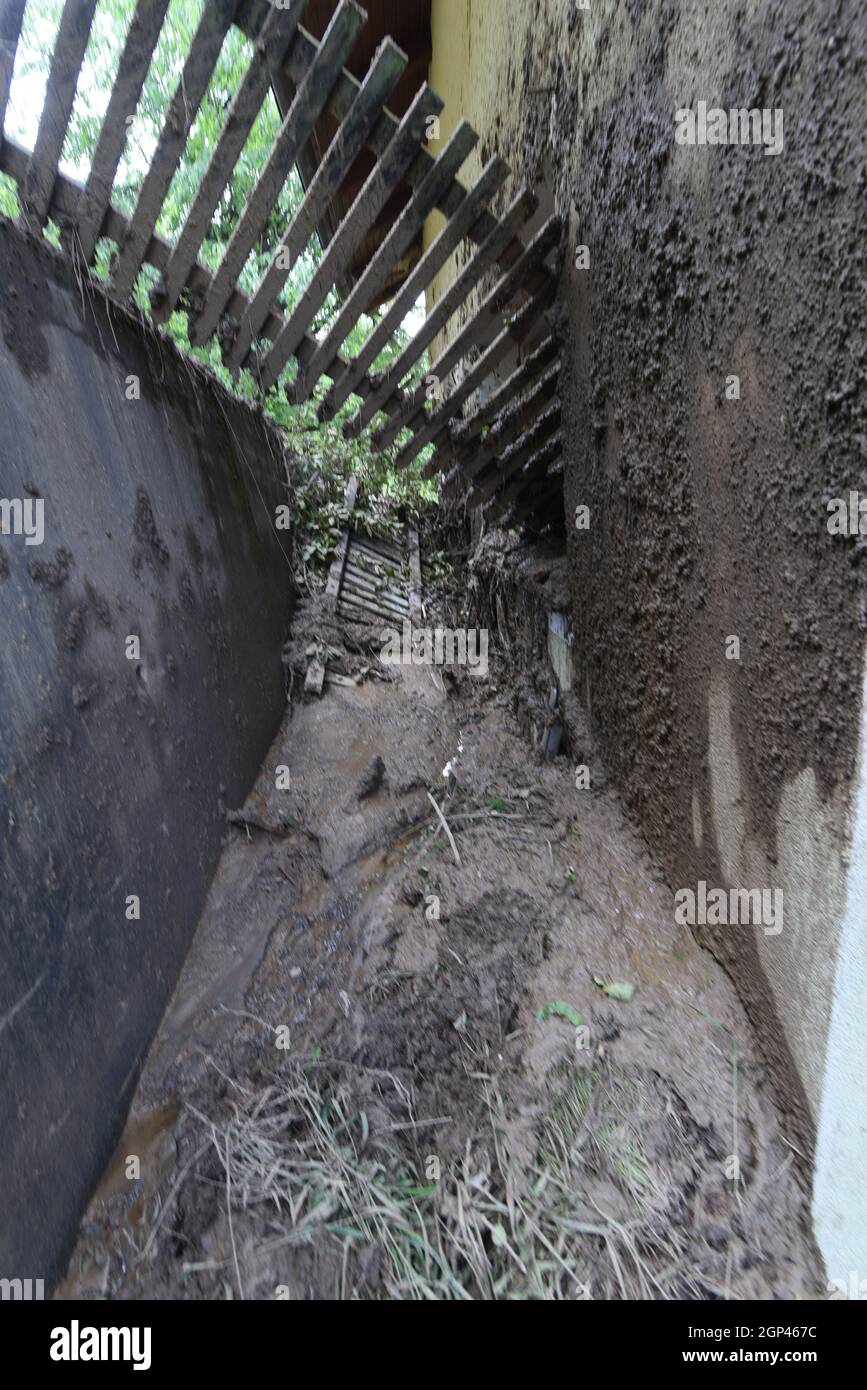 storm damage caused by mudslides, debris and mud after heavy rainfalls ...