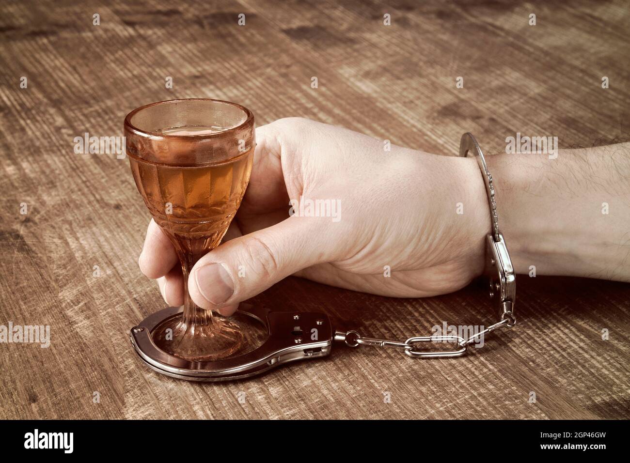 Alcohol addiction, hand handcuffed with an alcohol glass Stock Photo ...