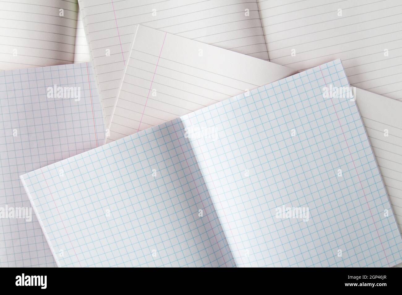 Various exercise books with copy-space. Education concept Stock Photo ...