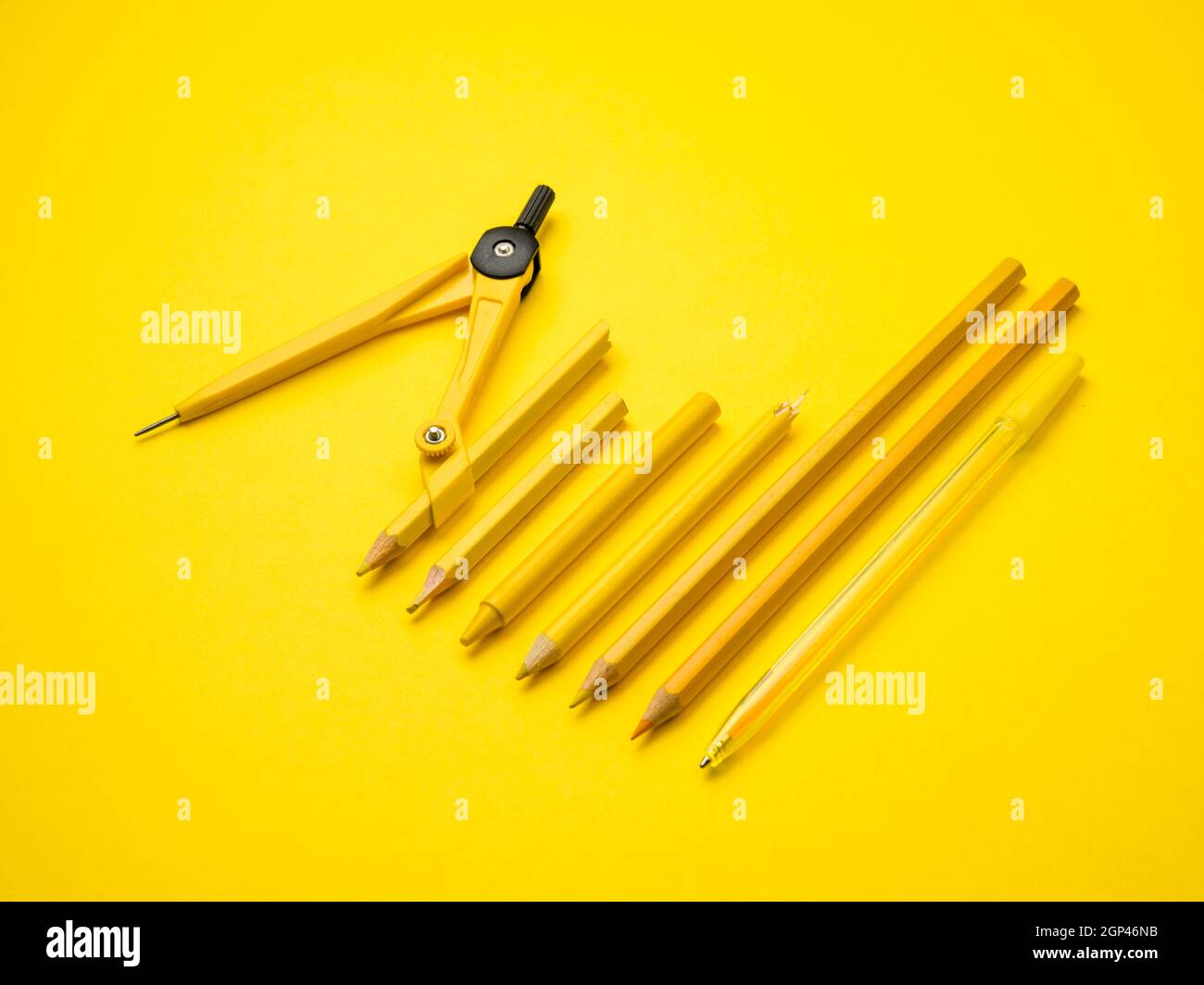 Yellow compass over a yellow background Stock Photo - Alamy