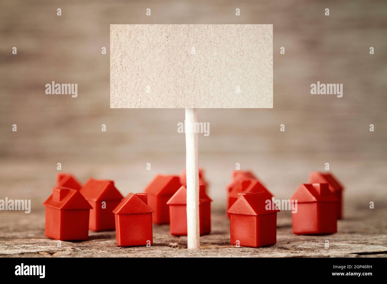 Blank sign with mini red houses,concept for real estate Stock Photo - Alamy