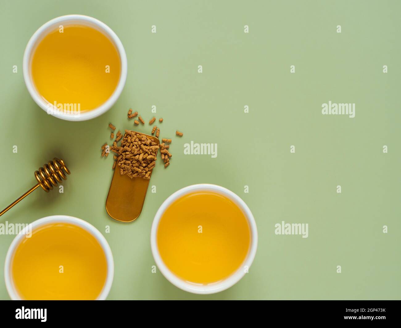 cups of buckwheat tea on light green background. Top view of healthy ...