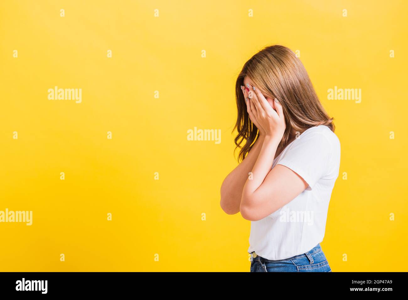 Woman embarrassed face in hands hi-res stock photography and images - Alamy