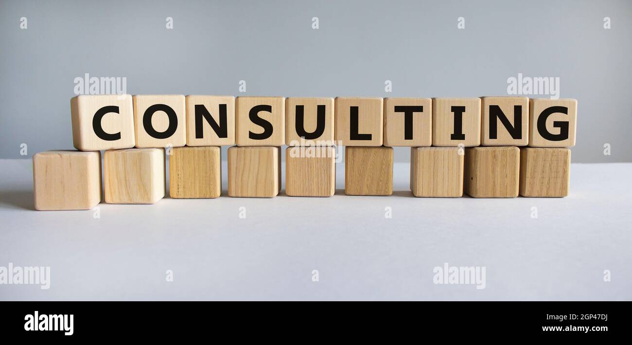 Consulting symbol. The word Consulting on wooden cubes. Beautiful white ...