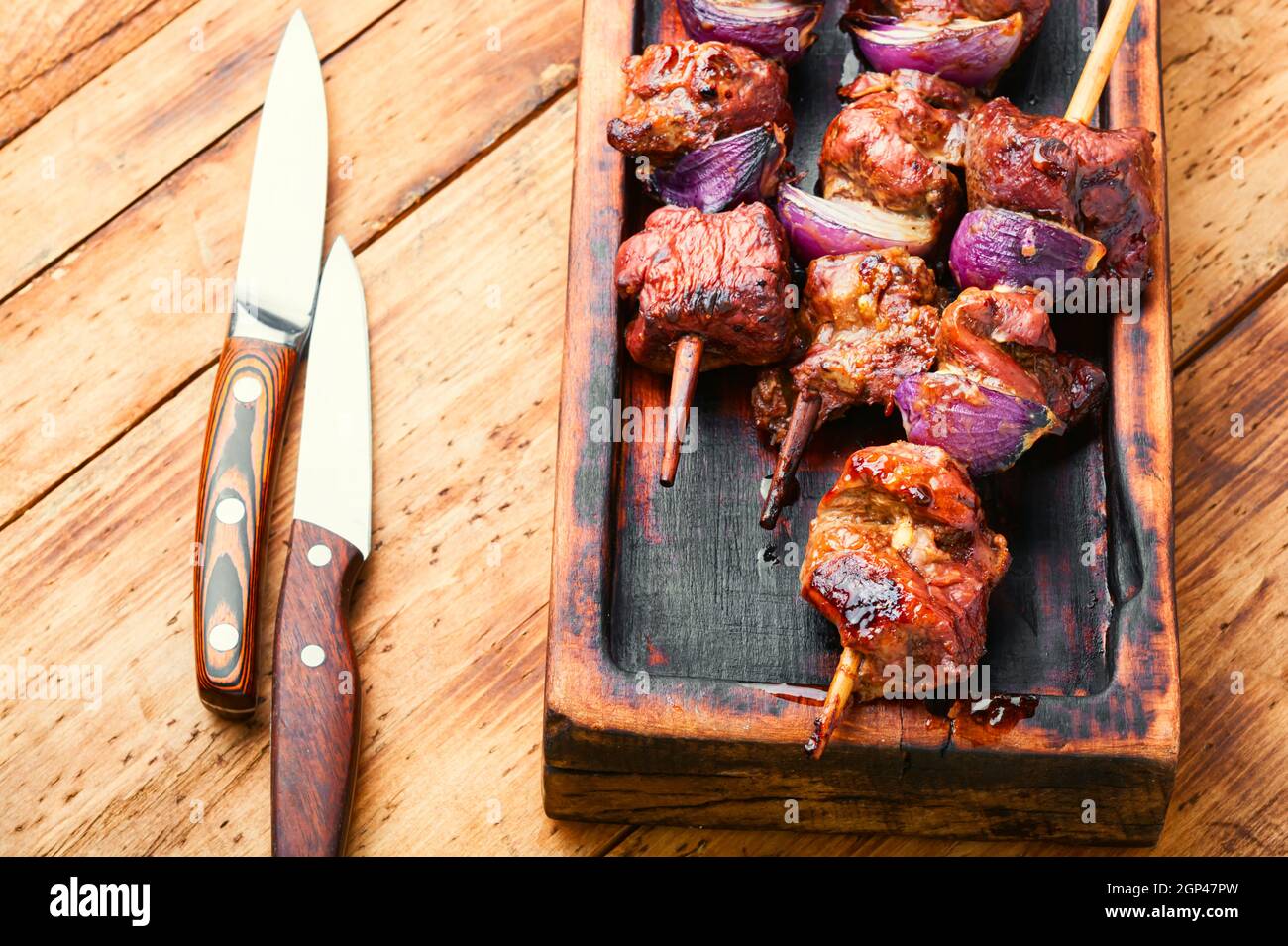 Grilled liver kebab with onion on wooden skewers Stock Photo - Alamy