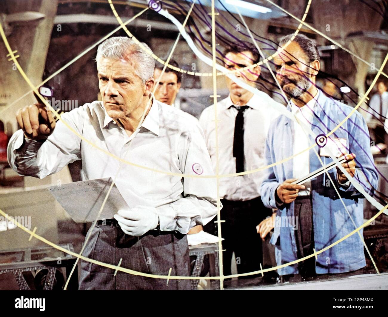 CRACK IN THE WORLD, Dana Andrews (left), Kieron Moore (in black tie ...