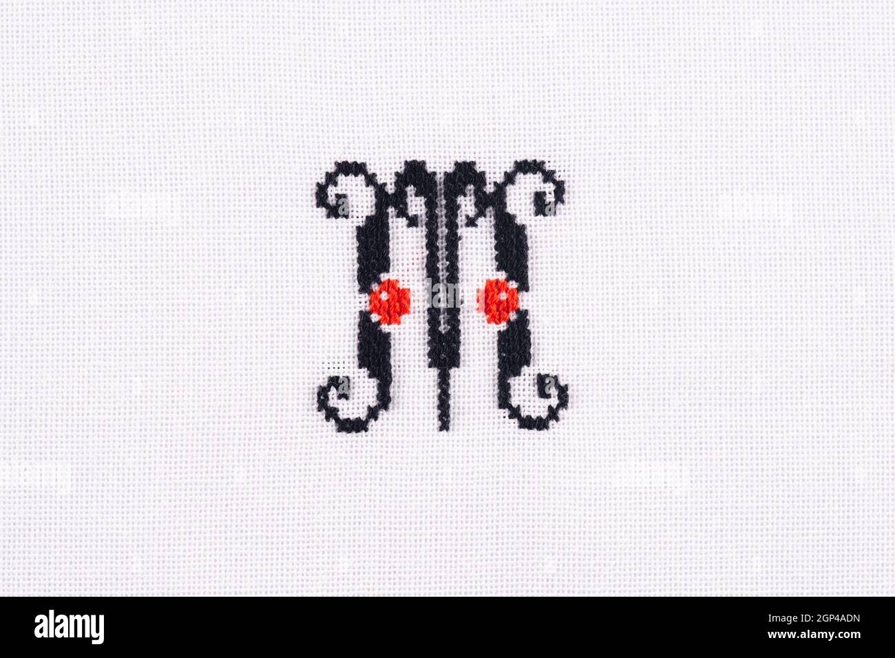 Letter M of Embroidered Cross - Stitch Latin Alphabet on White Linen ...