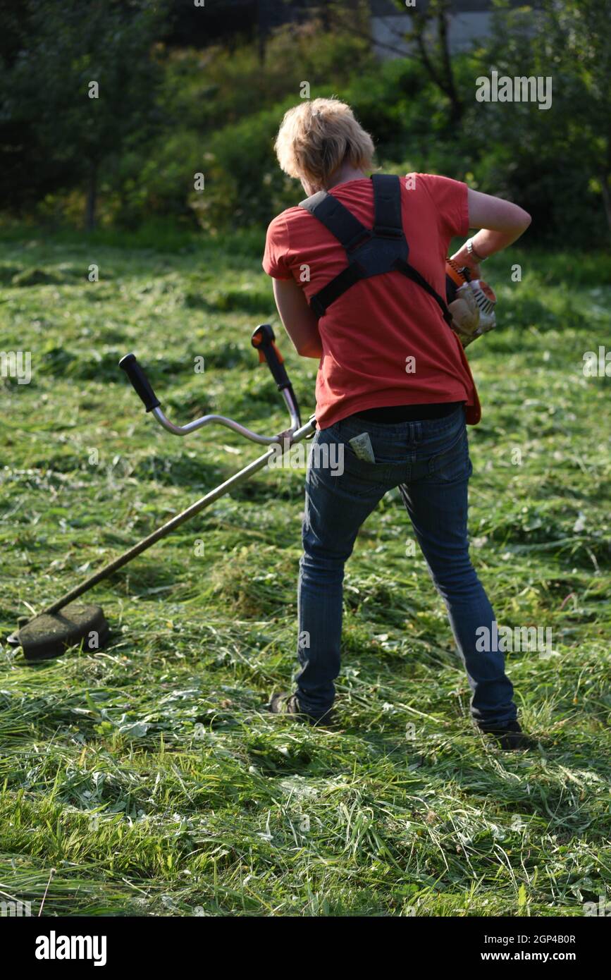 Scythe mowing hi-res stock photography and images - Alamy