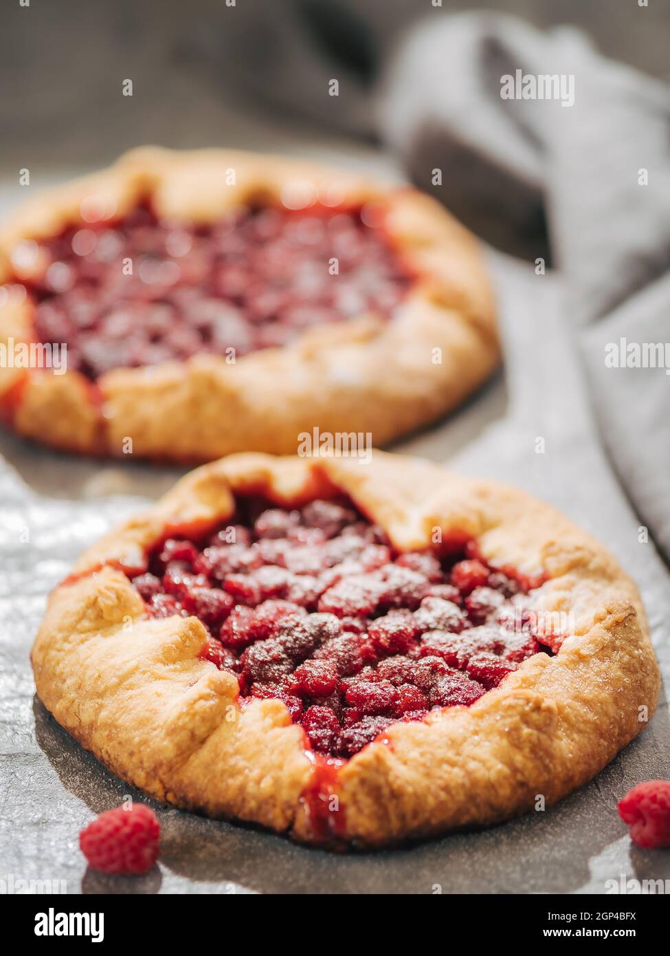 Two perfect raspberry galettes. Delicious rustic homemade tart with ...