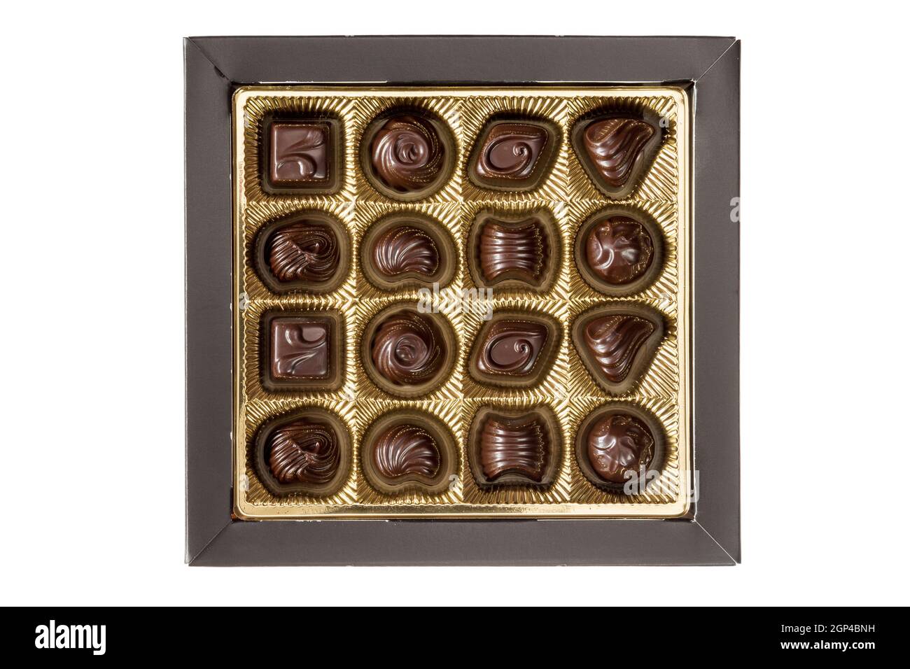 Dark chocolate pralines in a square box isolated on white background ...