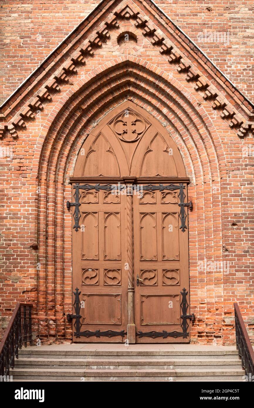 Catholic church front entrance with old wooden doors Stock Photo - Alamy