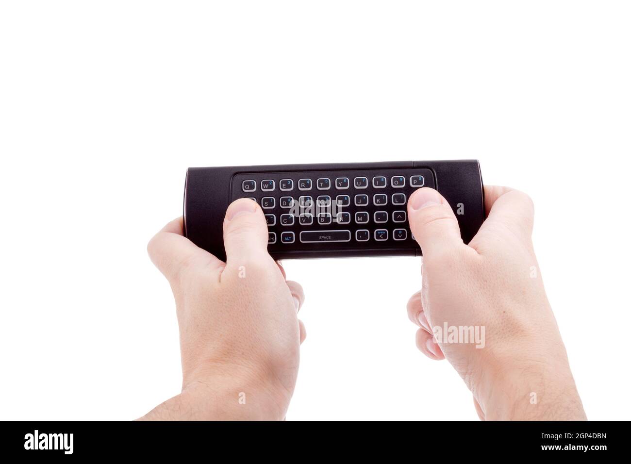 Hands holding smart tv remote control with keyboard. Isolated on white ...