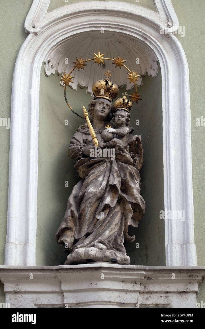 Church tower with statue of mary and baby jesus hi-res stock ...