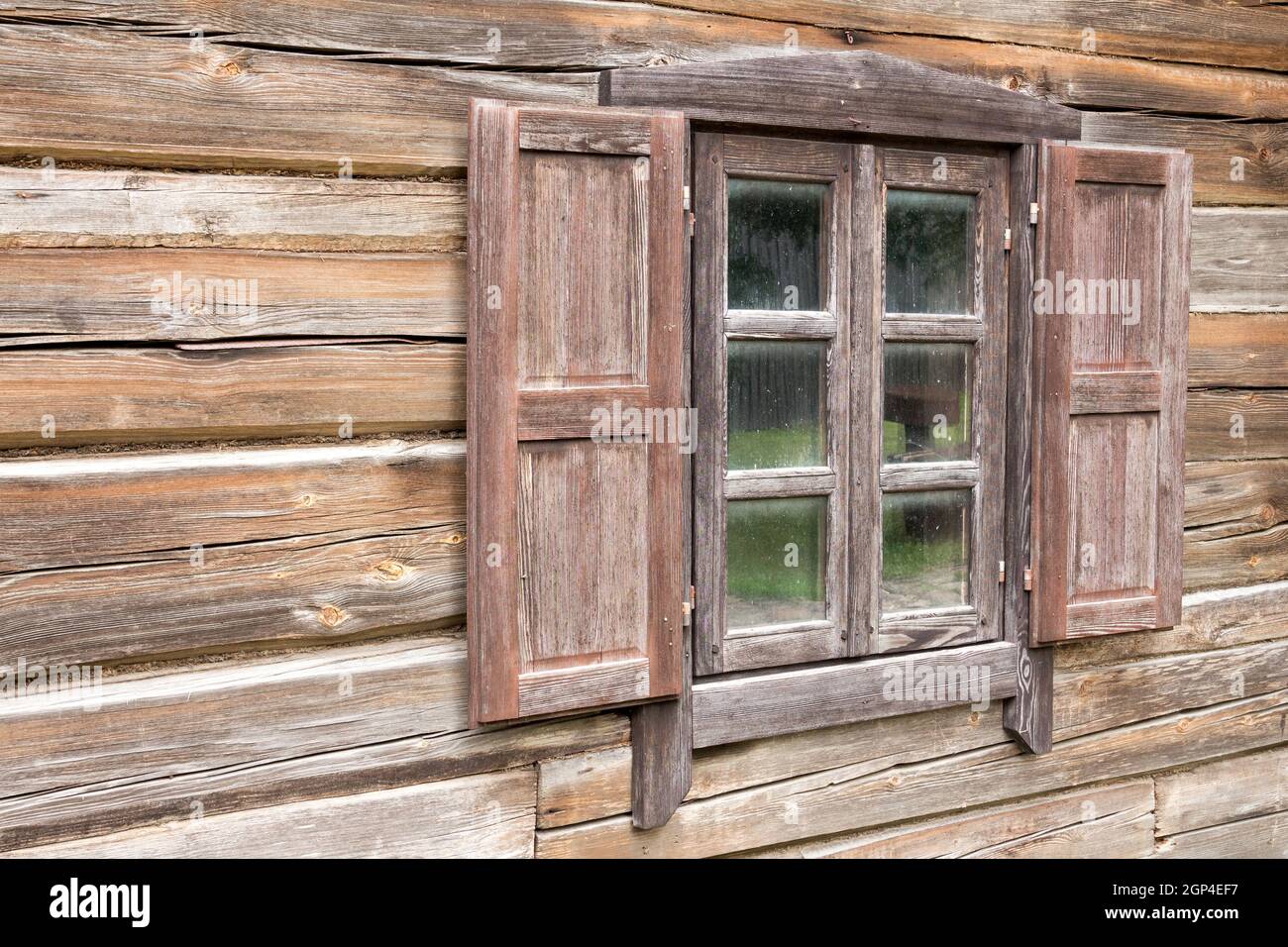 Wooden log house,window with open shutters Stock Photo - Alamy