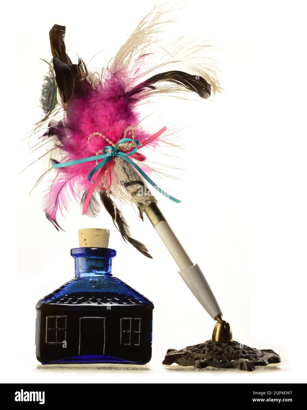 An isolated over white background image of a glass jar of ink and a ...