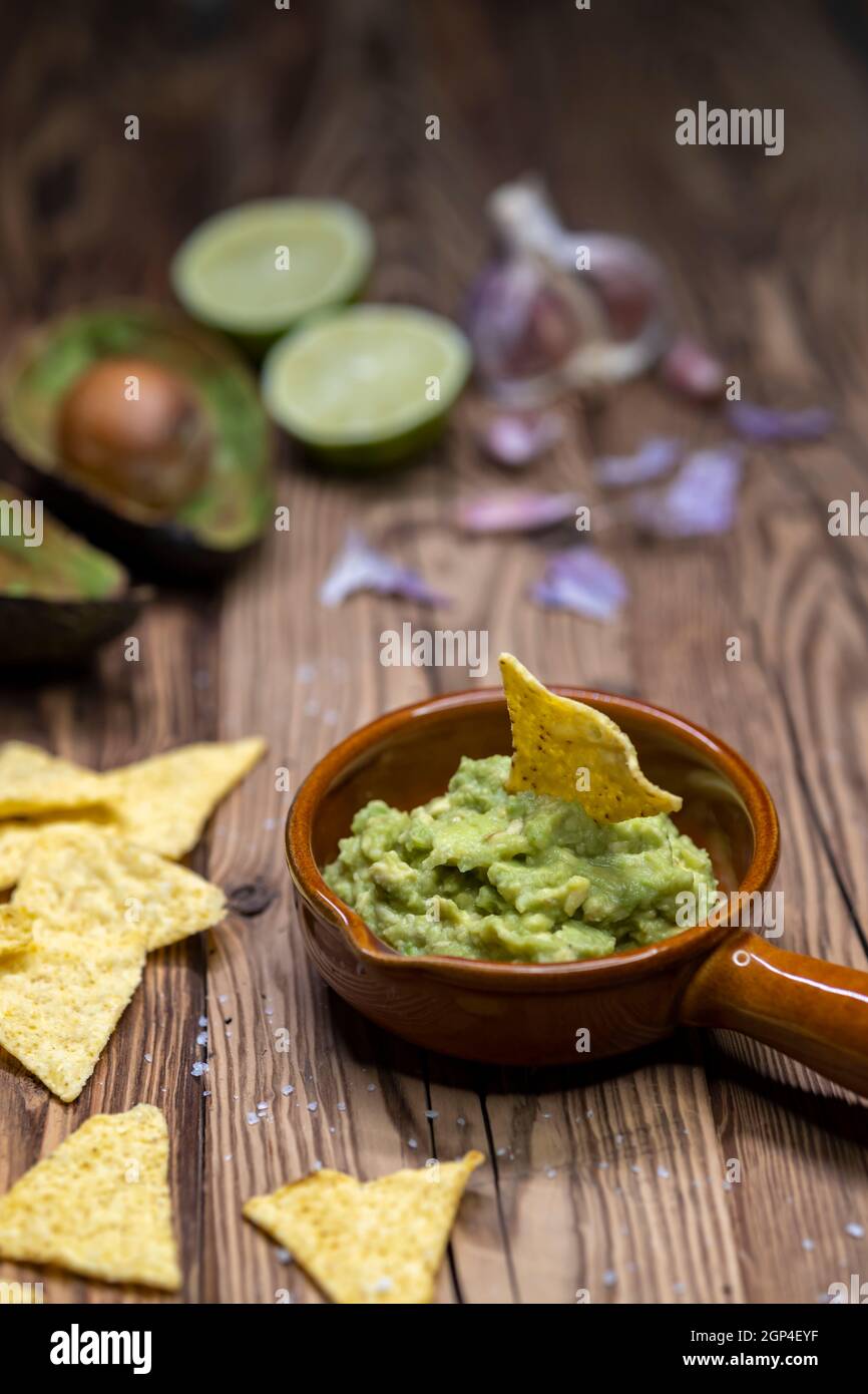 avocado dip flavored with garlic, chili, pepper, and lime juice with ...