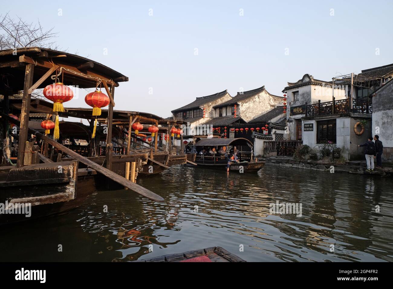 Tourist boats on the water canals of Xitang Town in Zhejiang Province ...