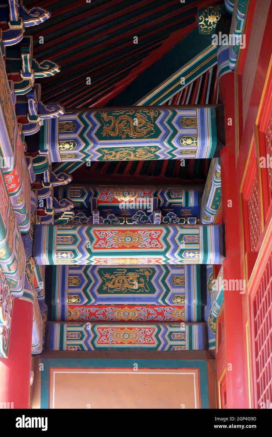 Ornate painted ceiling on a building in the Forbidden City in Beijing ...