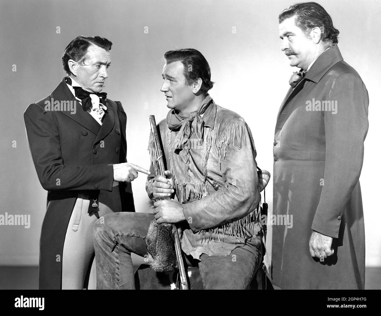 THE FIGHTING KENTUCKIAN, from left, Paul Fix, John Wayne, Grant Withers ...