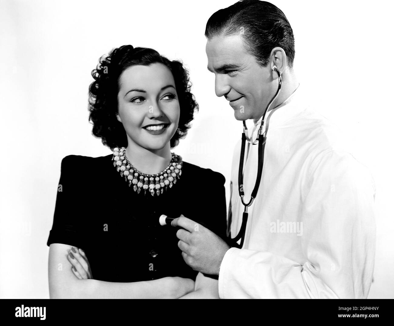 FREE, BLONDE AND 21, from left, Lynn Bari, Henry Wilcoxon, 1940. TM ...