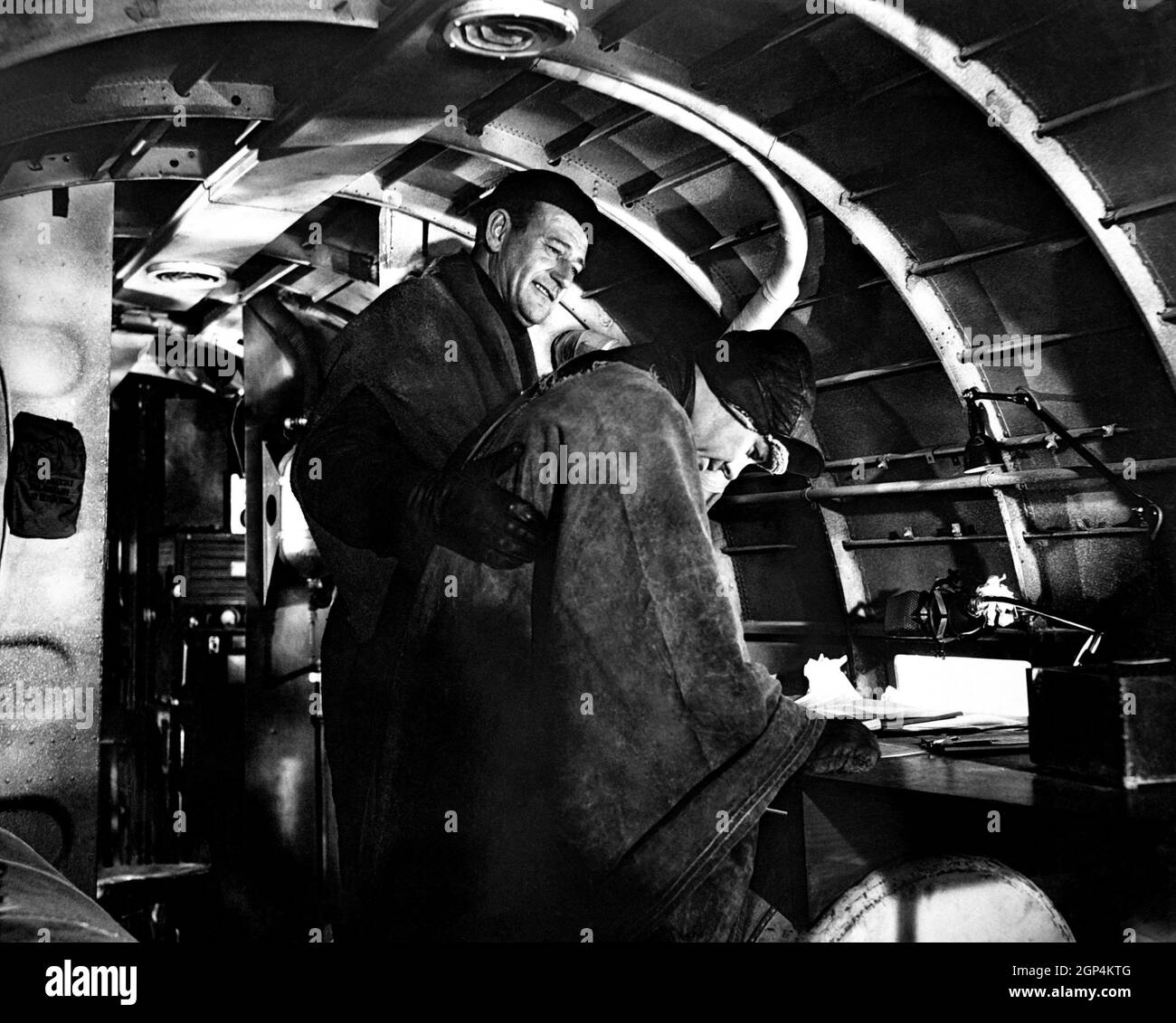 ISLAND IN THE SKY, from left, John Wayne, James Lydon, 1953 Stock Photo ...