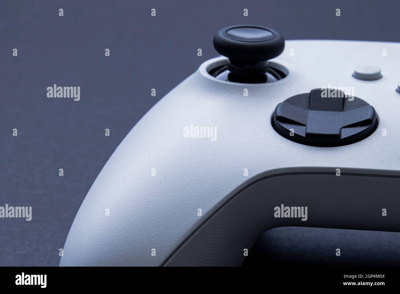 A Video game white control remote game pad on grey background Stock ...