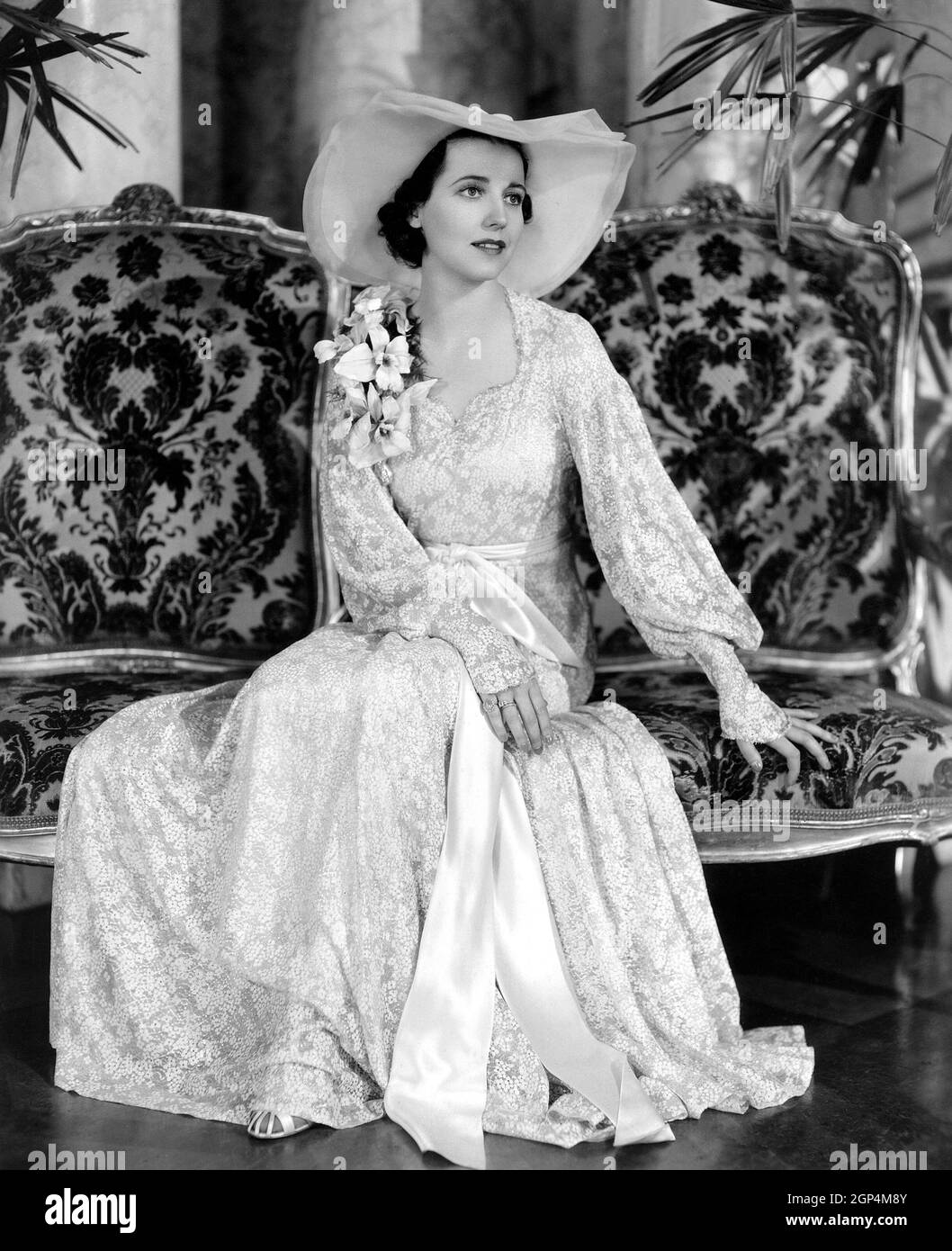 KING OF BURLESQUE, Mona Barrie (in a gown by Gwen Wakeling), 1936. TM ...