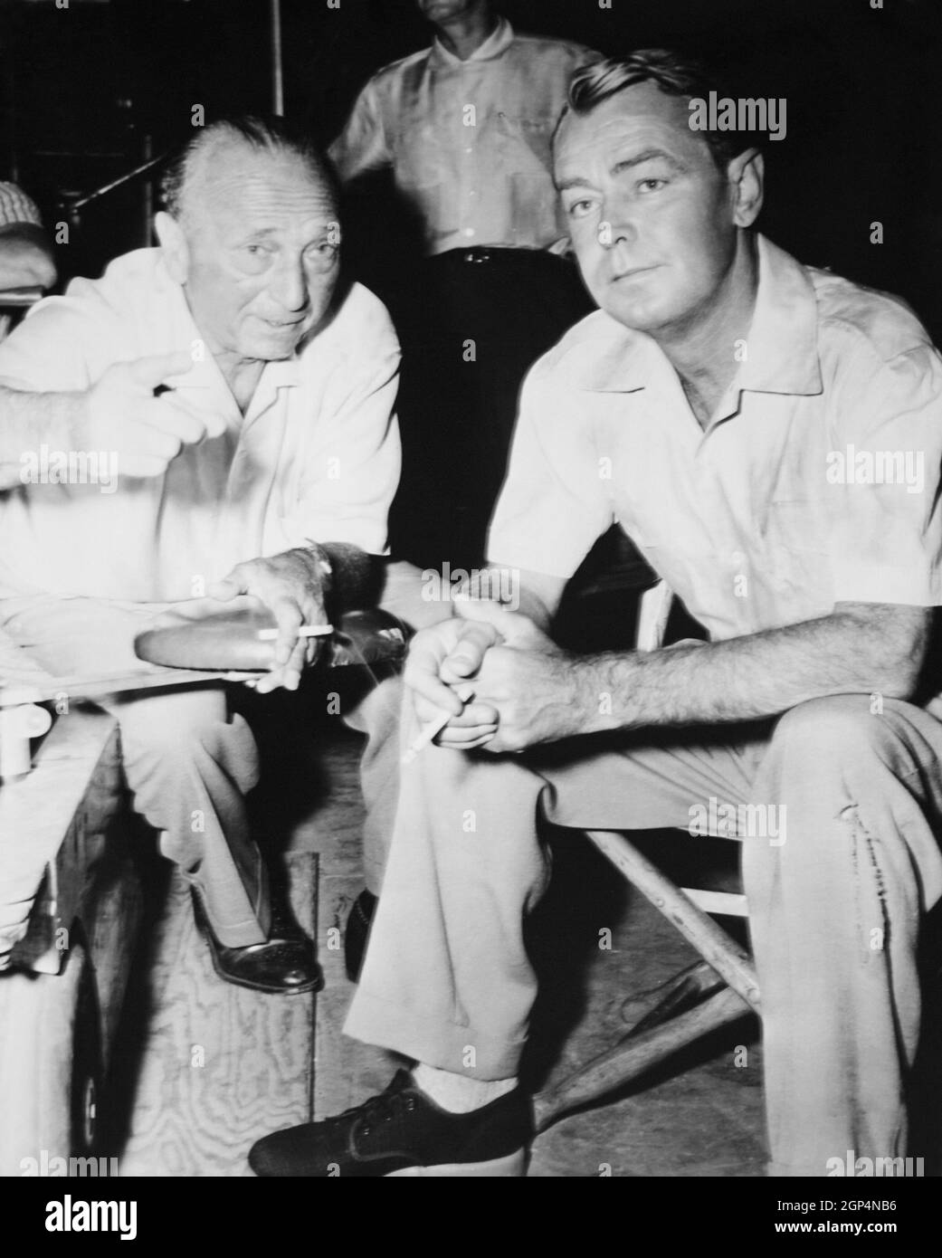 THE MAN IN THE NET, from left: director Michael Curtiz, Alan Ladd on set, 1959 Stock Photo - Alamy