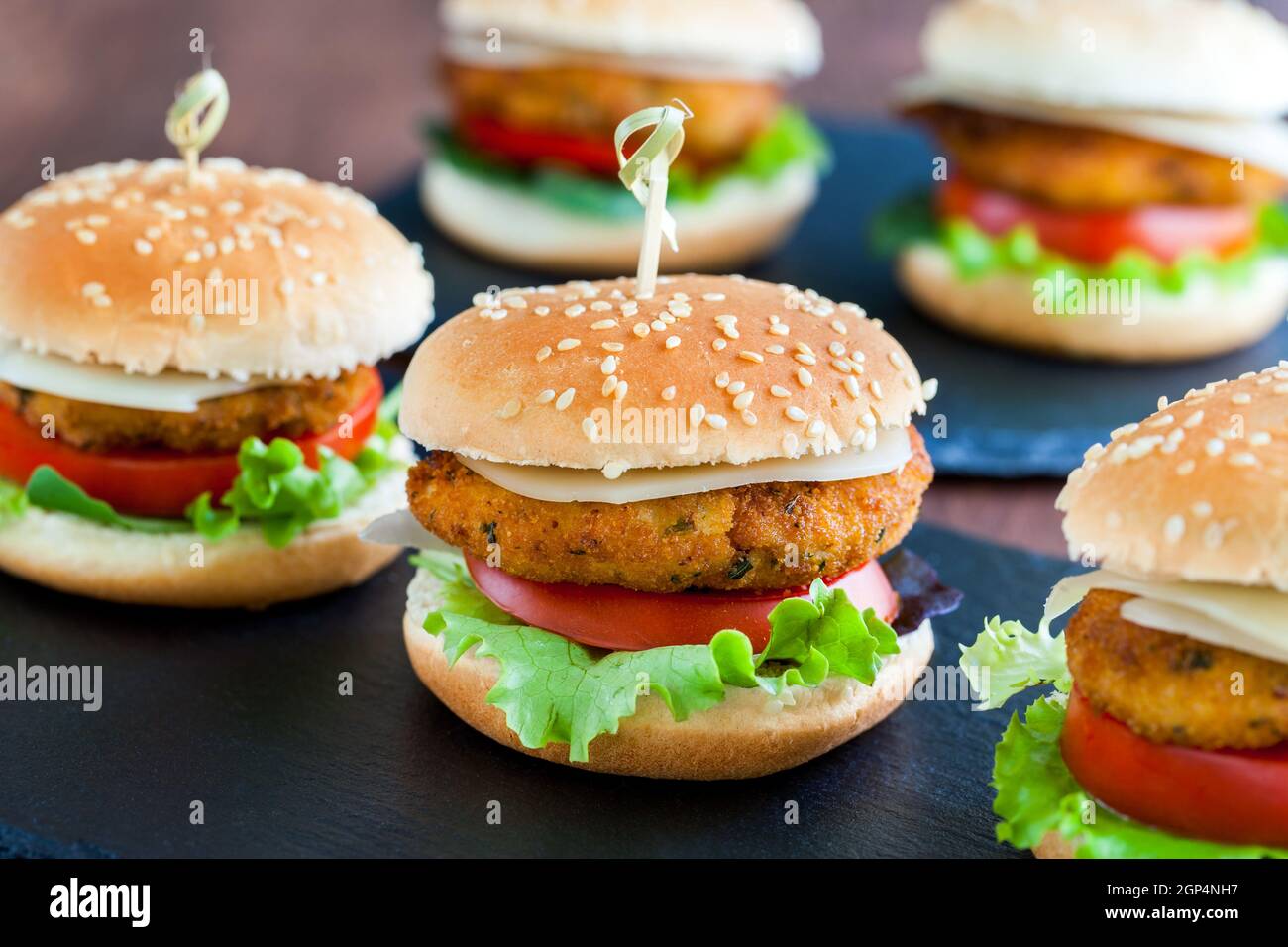 Extreme close up of multiple Appetizing mini chicken burgers. Small ...