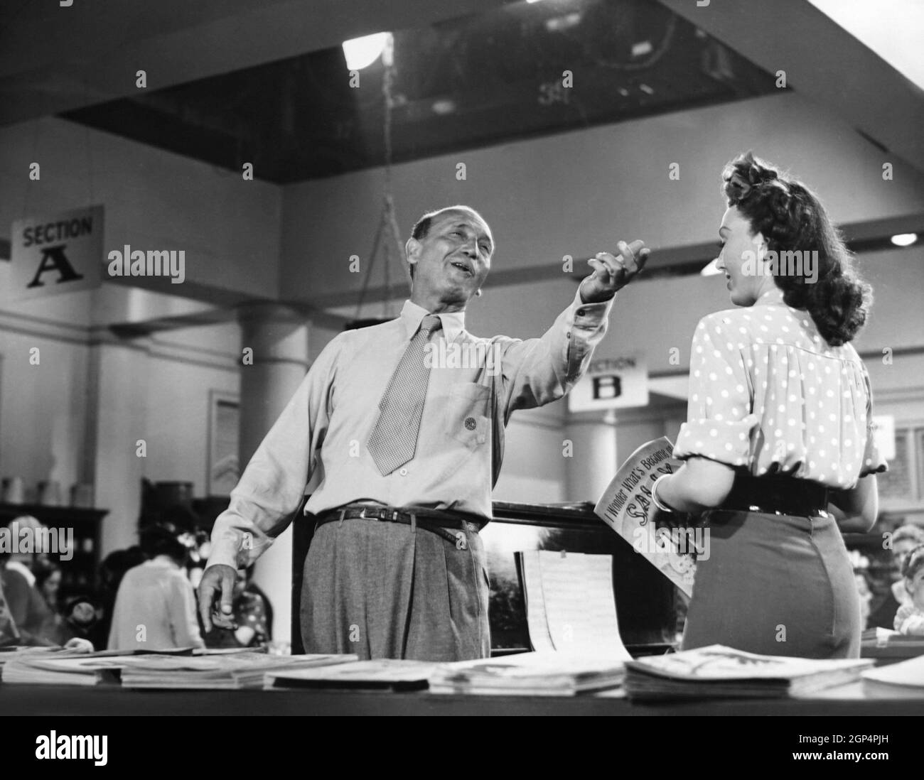 NIGHT AND DAY, from left; director Michael Curtiz, Ginny Simms on set ...