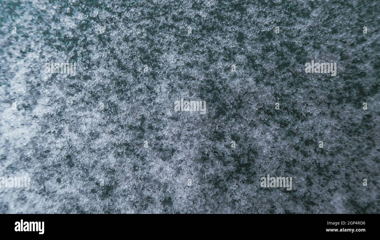 Snow and frozen water background of winter Stock Photo - Alamy
