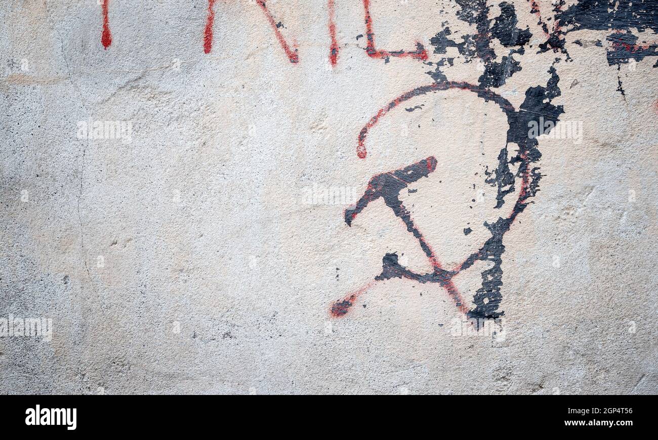 Old grungy communism symbol graffiti on a wall, red color Stock Photo ...