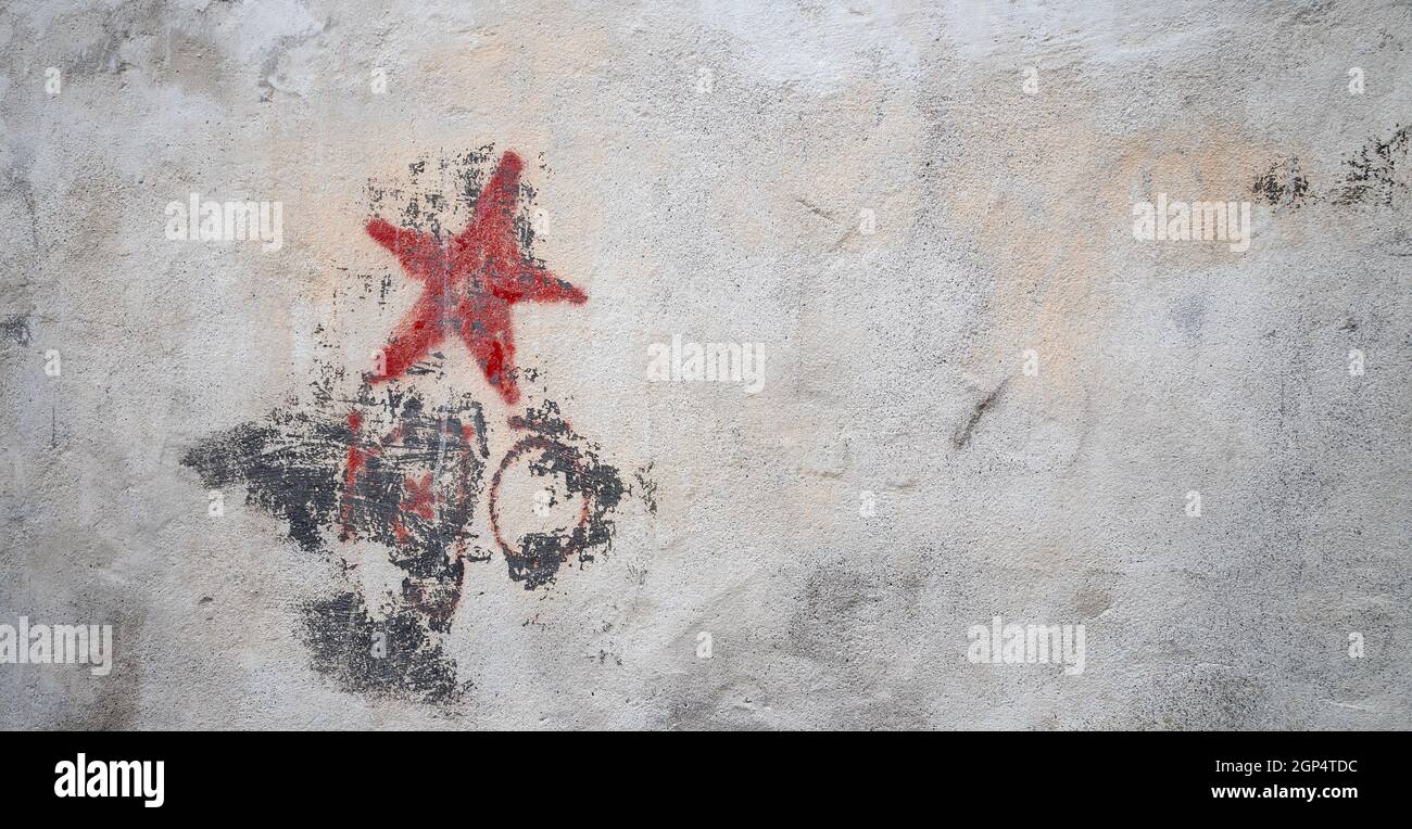 Old grungy communism symbol graffiti on a wall, red color Stock Photo ...