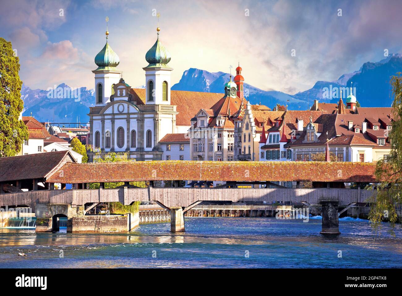 Luzern wooden river Bridge and church view, landmarks in town in ...