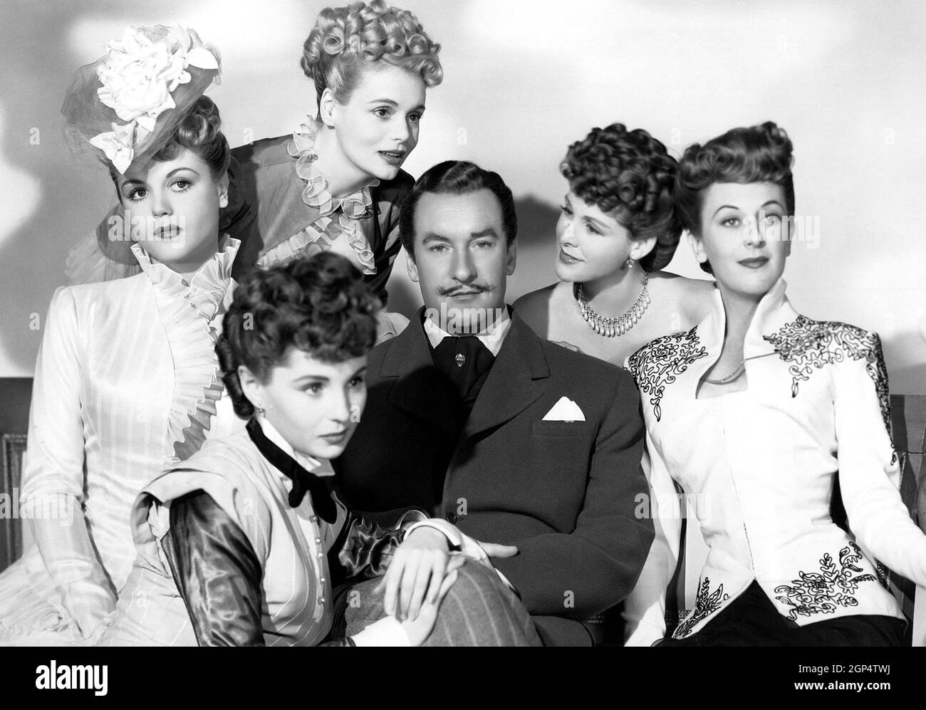 THE PRIVATE AFFAIRS OF BEL AMI, George Sanders, surrounded by (from ...