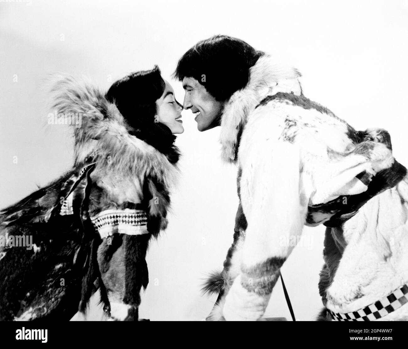 RED SNOW, from left, Gloria Saunders, Ray Mala, 1952 Stock Photo - Alamy