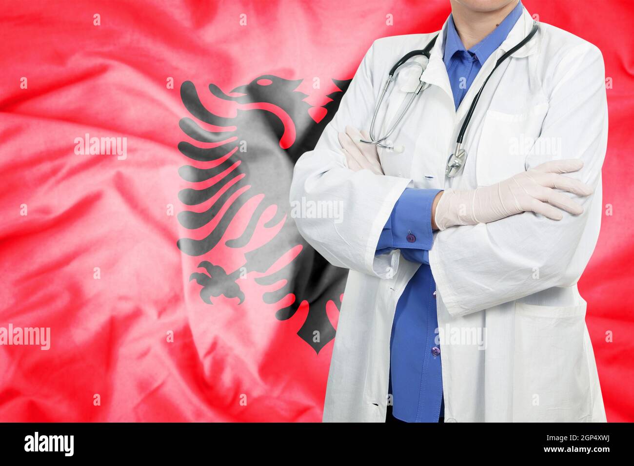 Doctor standing with the flag Stock Photo - Alamy