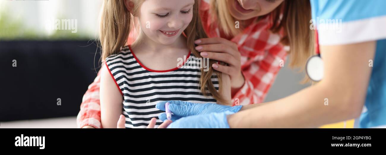 Pediatrician doctor takes blood test from little girl closeup Stock ...