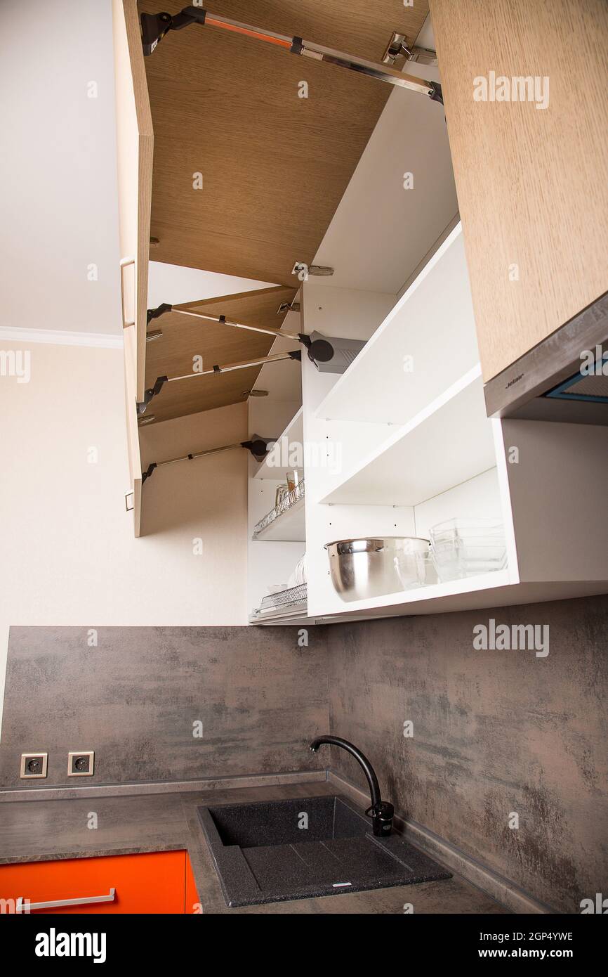 Elements of kitchen equipment in a modern home. Storage system in the ...