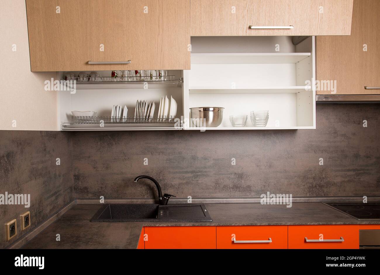 Elements of kitchen equipment in a modern home. Storage system in the ...