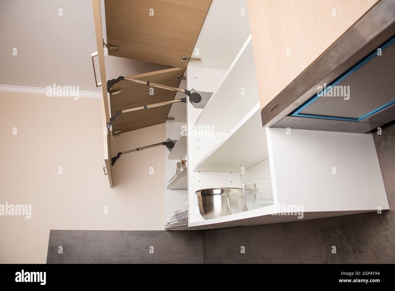 Elements of kitchen equipment in a modern home. Storage system in the ...