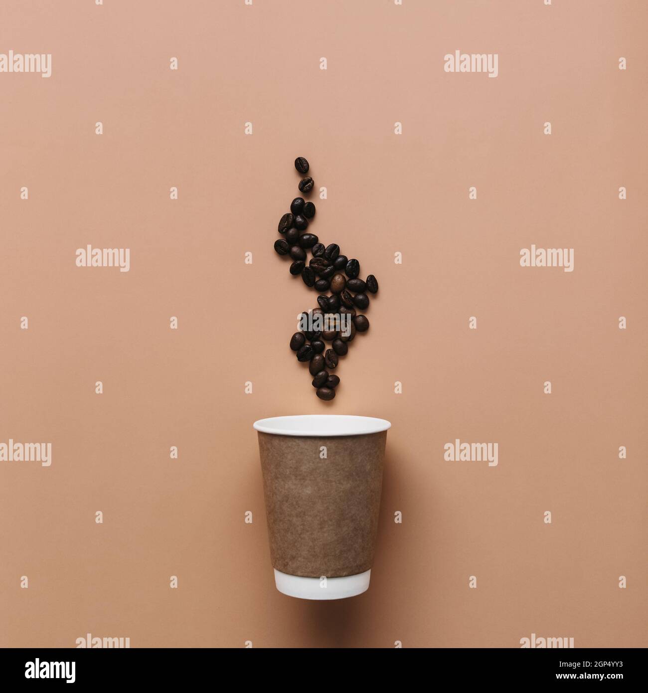 Beige background with paper coffee cup, coffee beans steam from hot ...