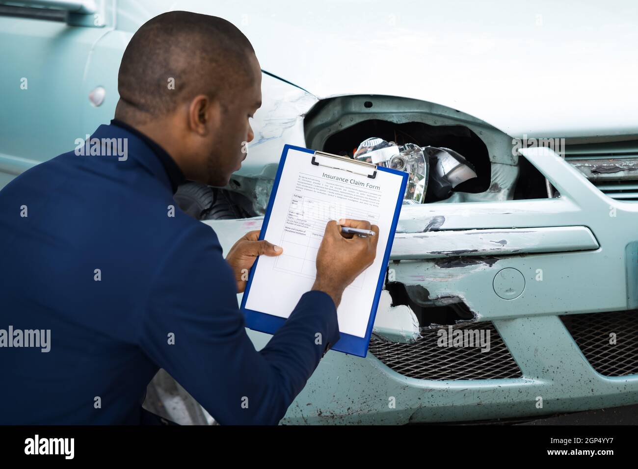 African American Car Insurance Agent Inspecting Accident Claim Stock ...