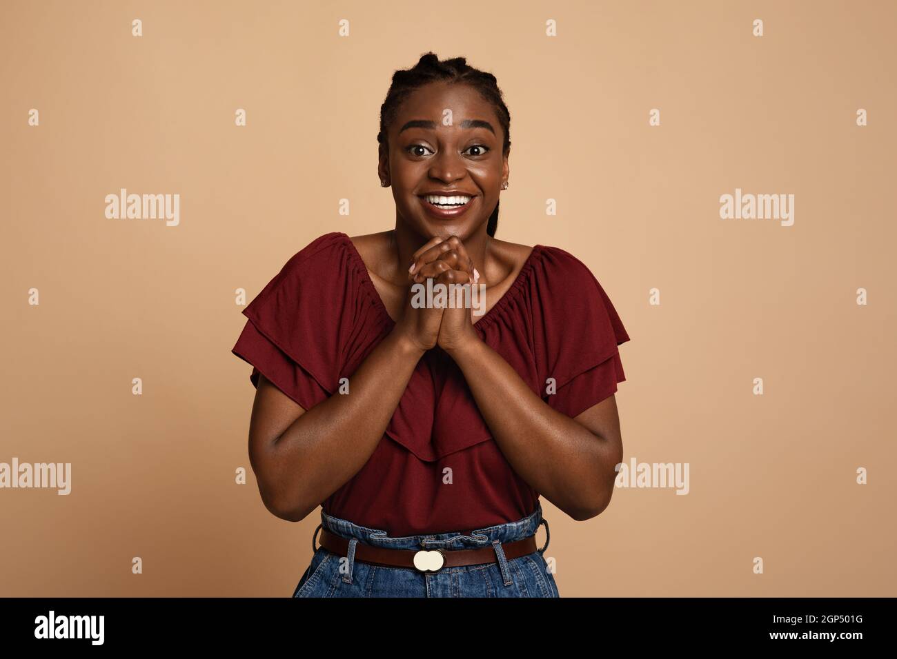Emotional african-american young woman expecting something exciting ...