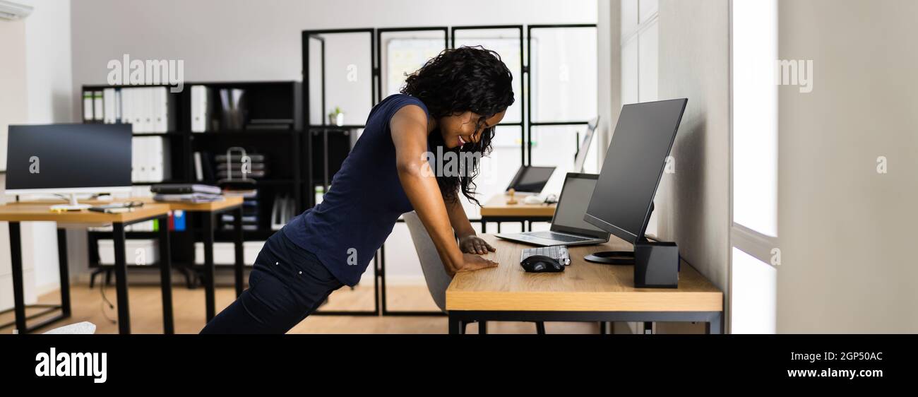 African American Doing Office Exercise Workout Training Stock Photo - Alamy