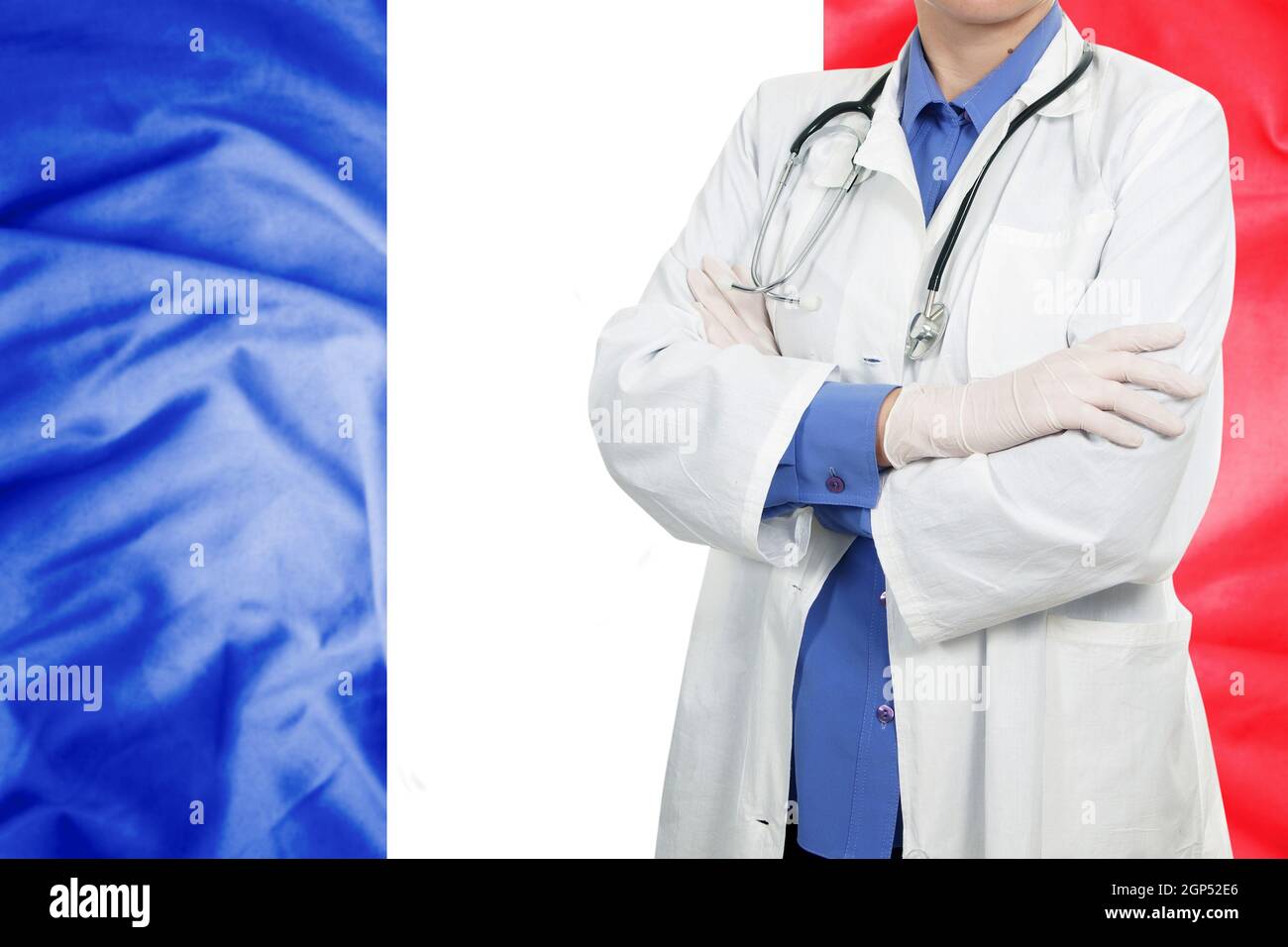 Doctor standing with the flag Stock Photo - Alamy