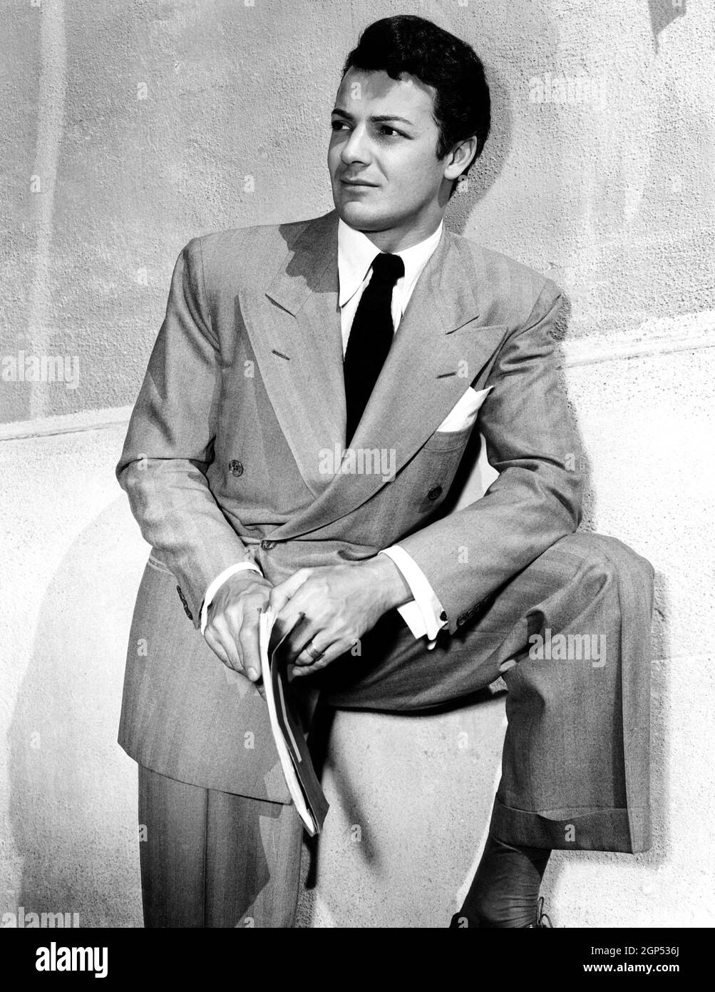 A THOUSAND AND ONE NIGHTS, Cornel Wilde, studying his script prior to ...